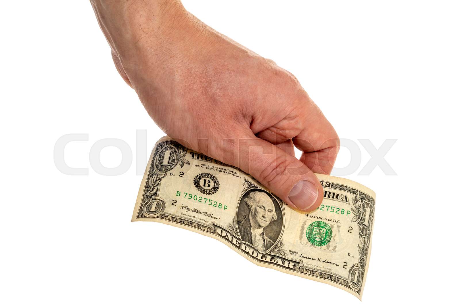Male hand holding one dollar bill | Stock image | Colourbox