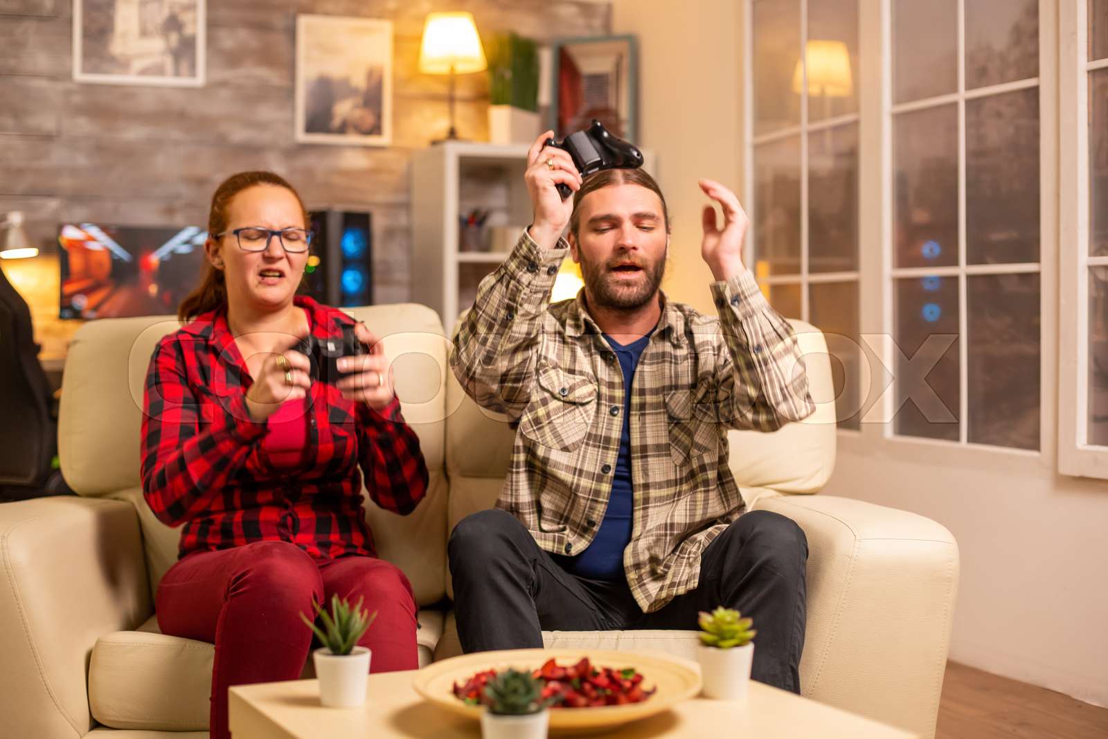 Angry and frustrated gamers losing while playing video games | Stock ...