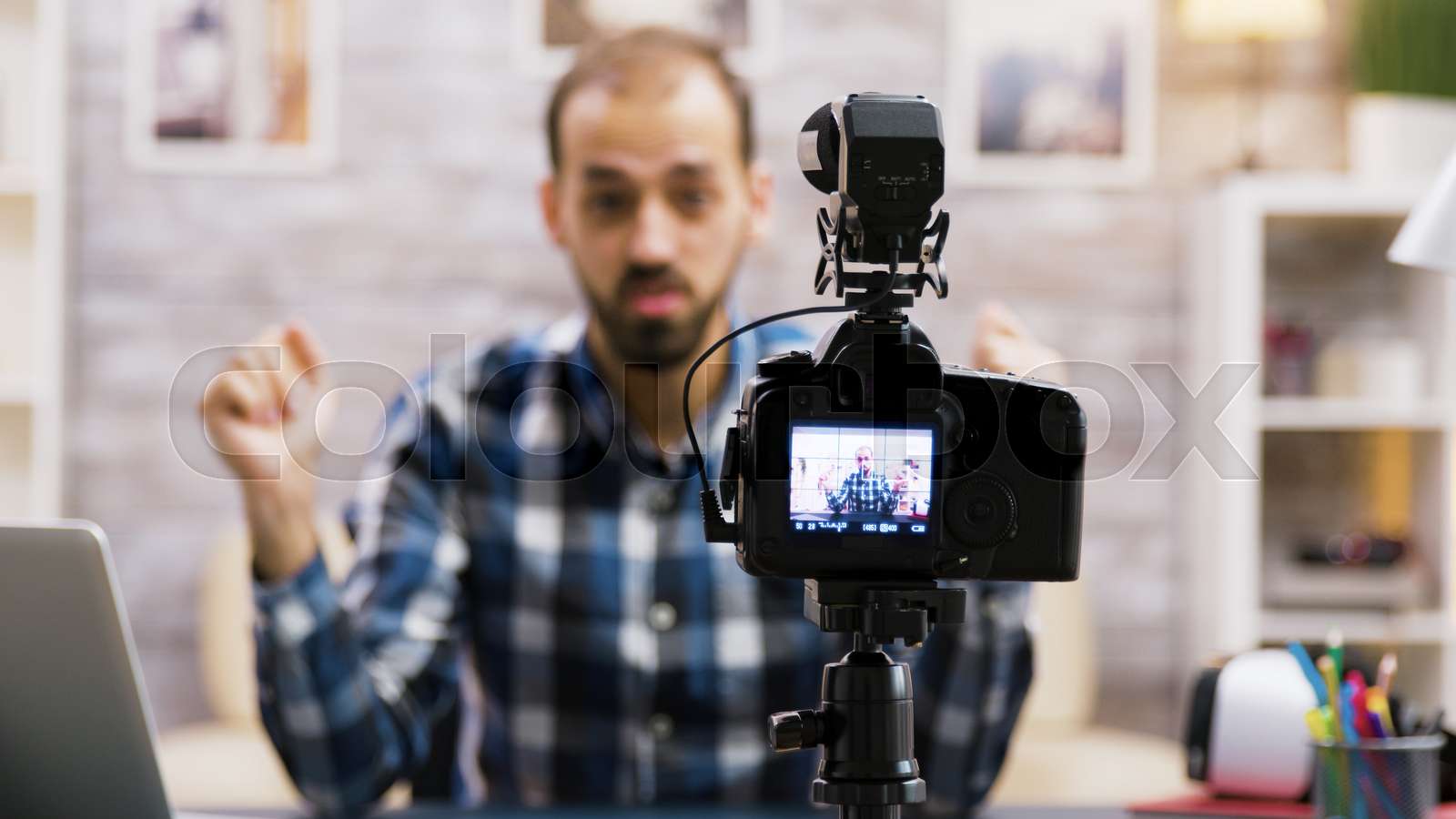 Creative young man talking in front of camera | Stock image | Colourbox