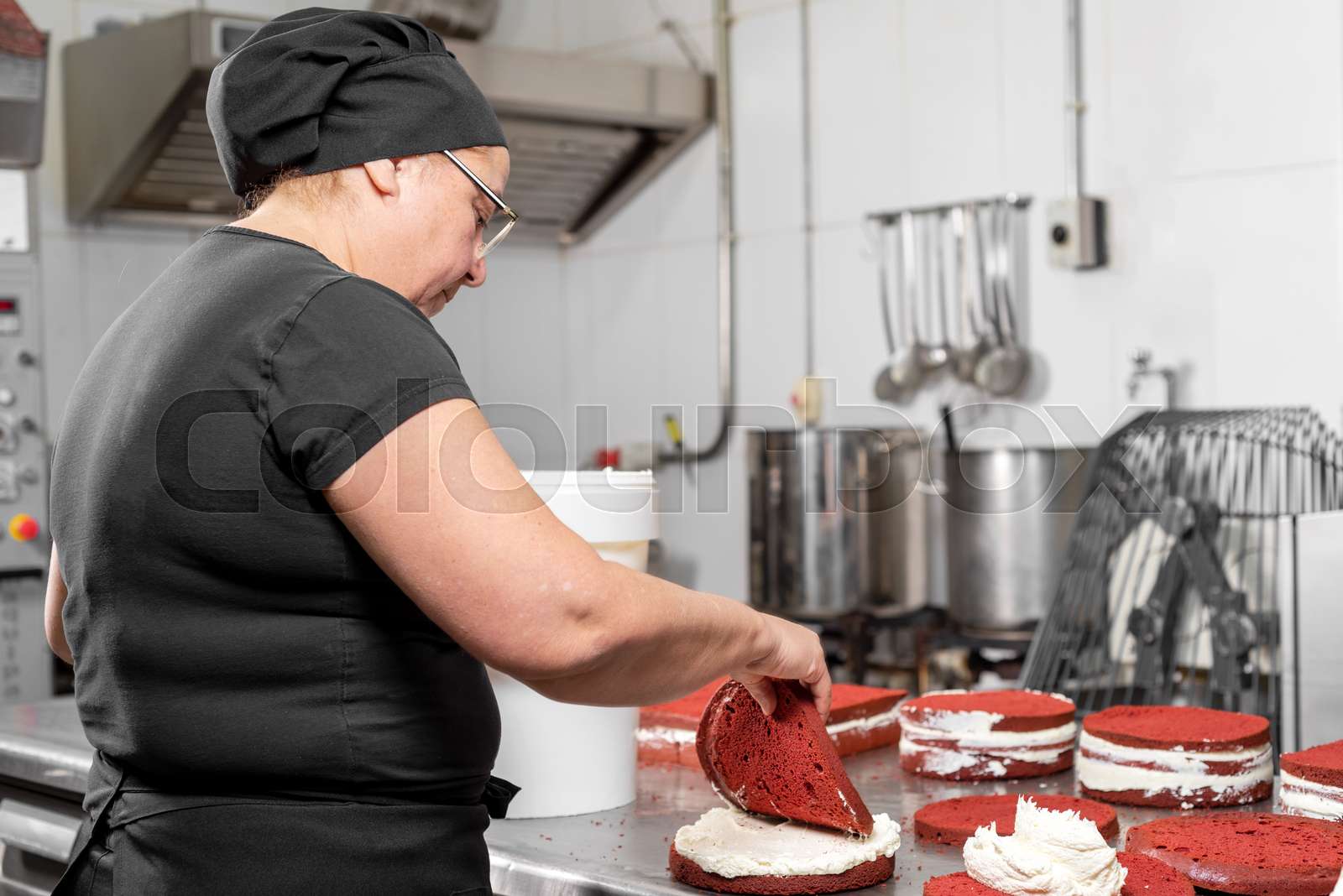 Woman pastry chef making cakes at the pastry shop. | Stock image ...