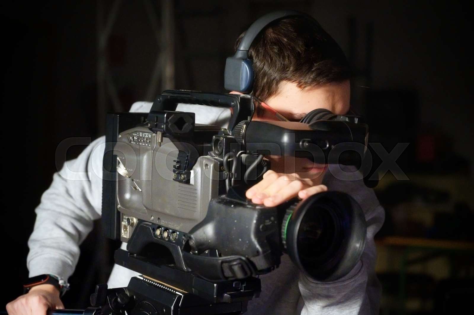 Cameraman using professional digital video camera. | Stock image ...