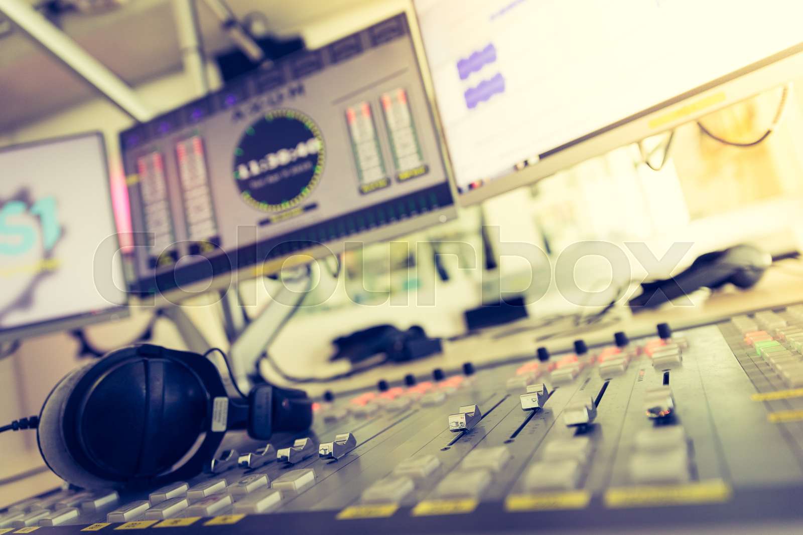 Radio broadcasting studio: Soundboard and computers | Stock image ...