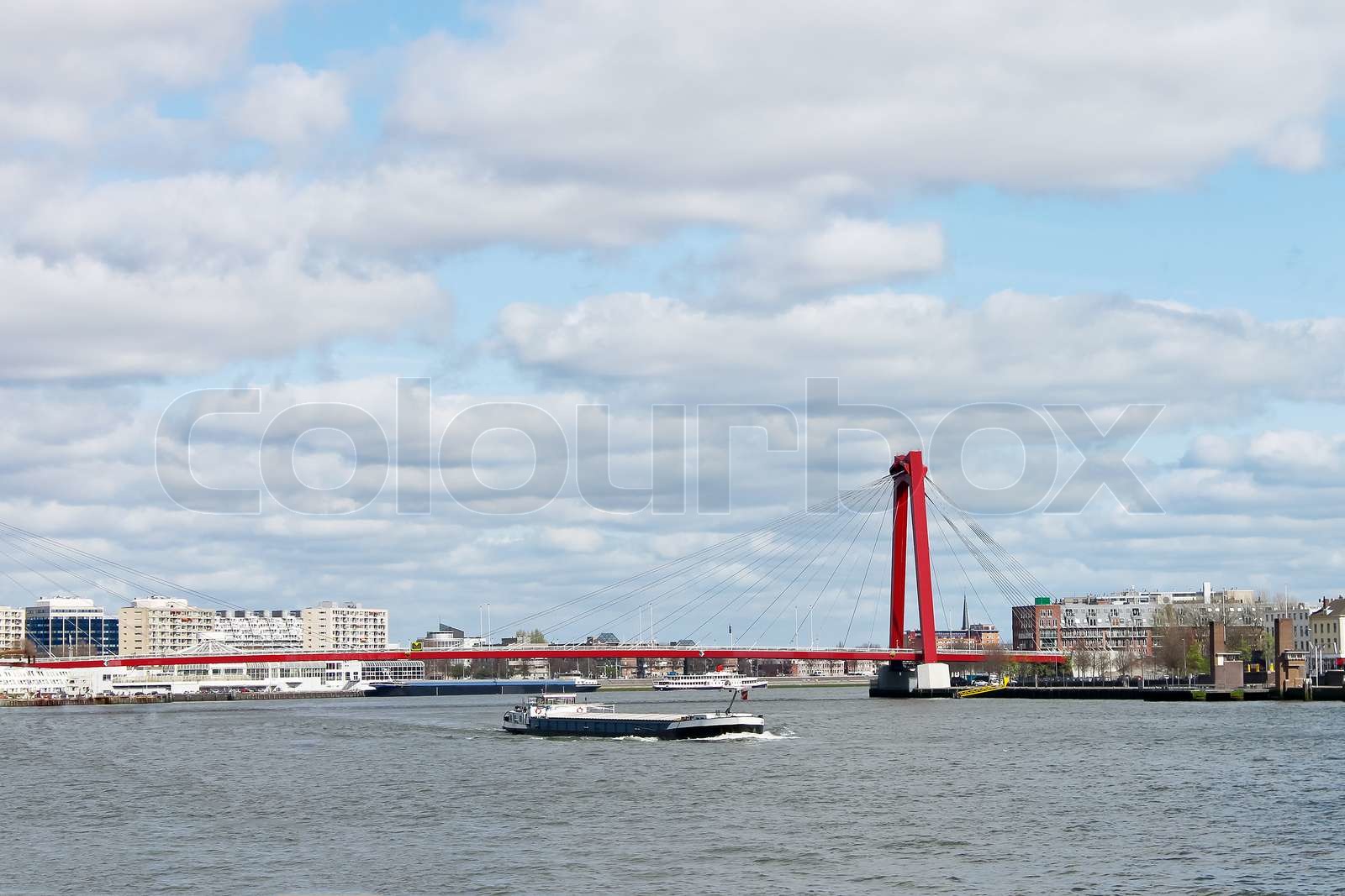 Red suspension bridge overMaas in Rotterdam Netherlands | Stock image ...