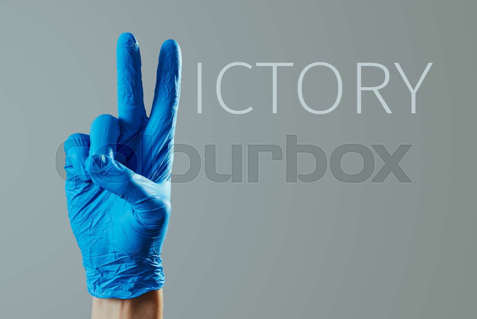 man doing the V sign and text victory | Stock image | Colourbox