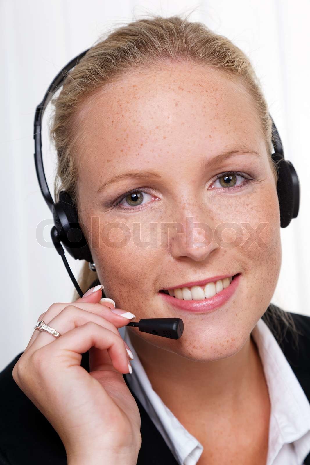 friendly woman with a headset in customer service | Stock image | Colourbox