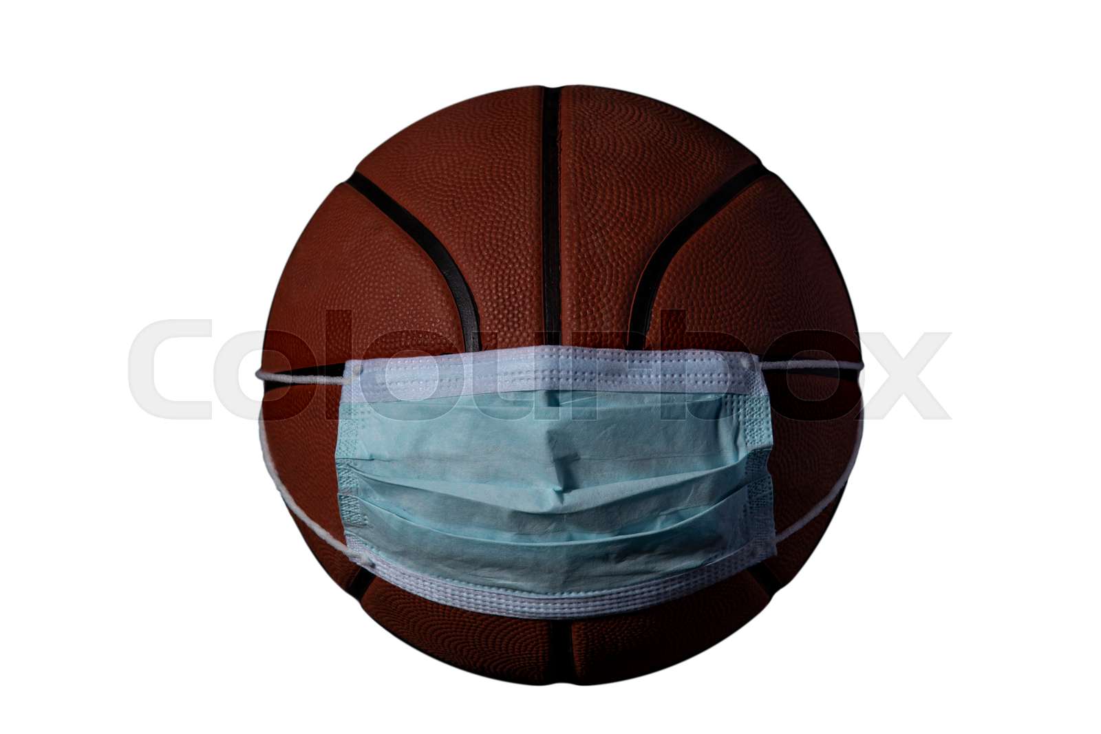 Basketball ball wearing a mask | Stock image | Colourbox