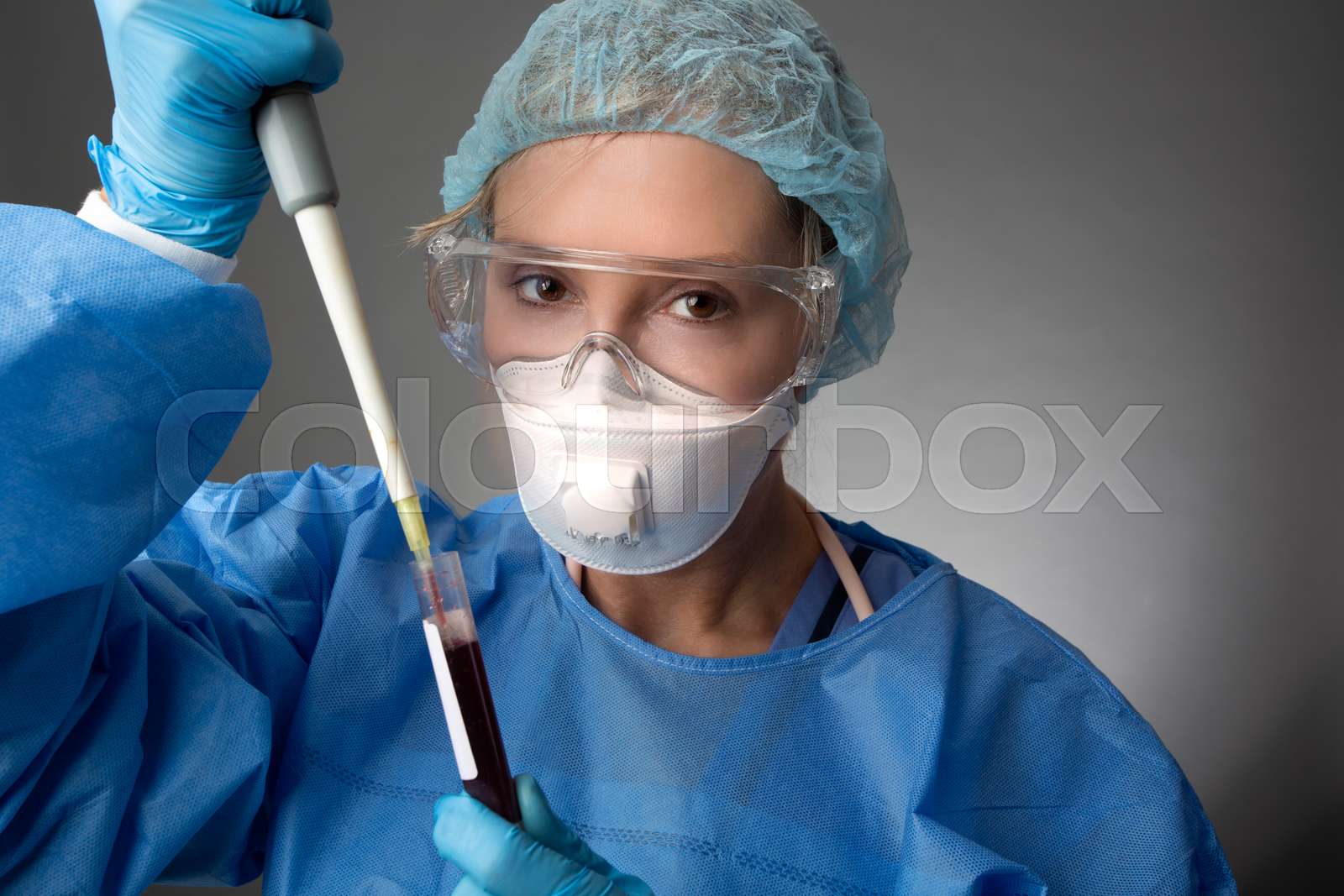 Laboratory pathologist pipetting a patient blood sample | Stock image ...