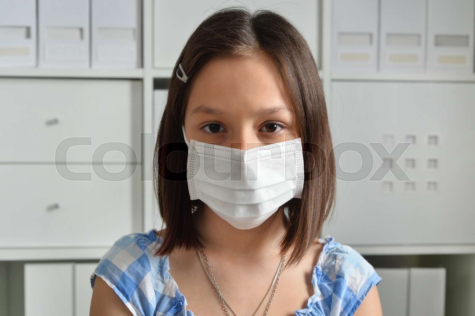 Portrait of little girl wearing facial mask | Stock image | Colourbox