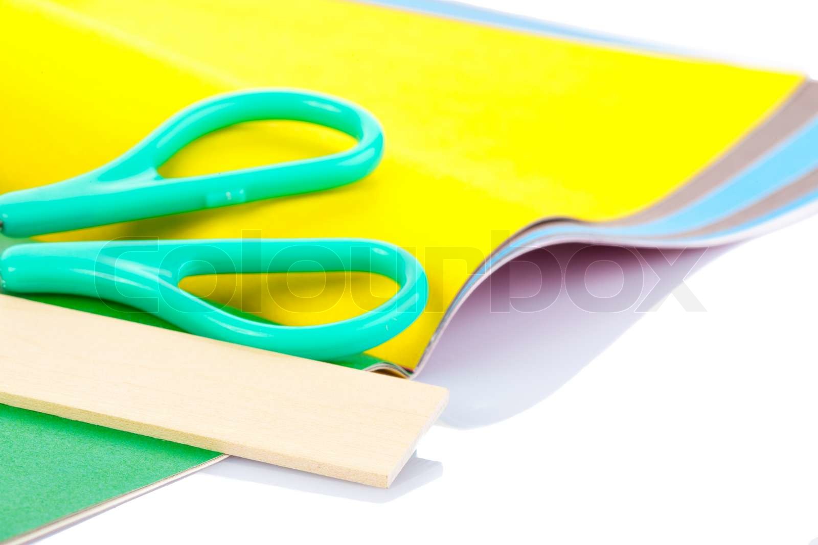 Scissor, ruler and paper sheets isolated | Stock image | Colourbox