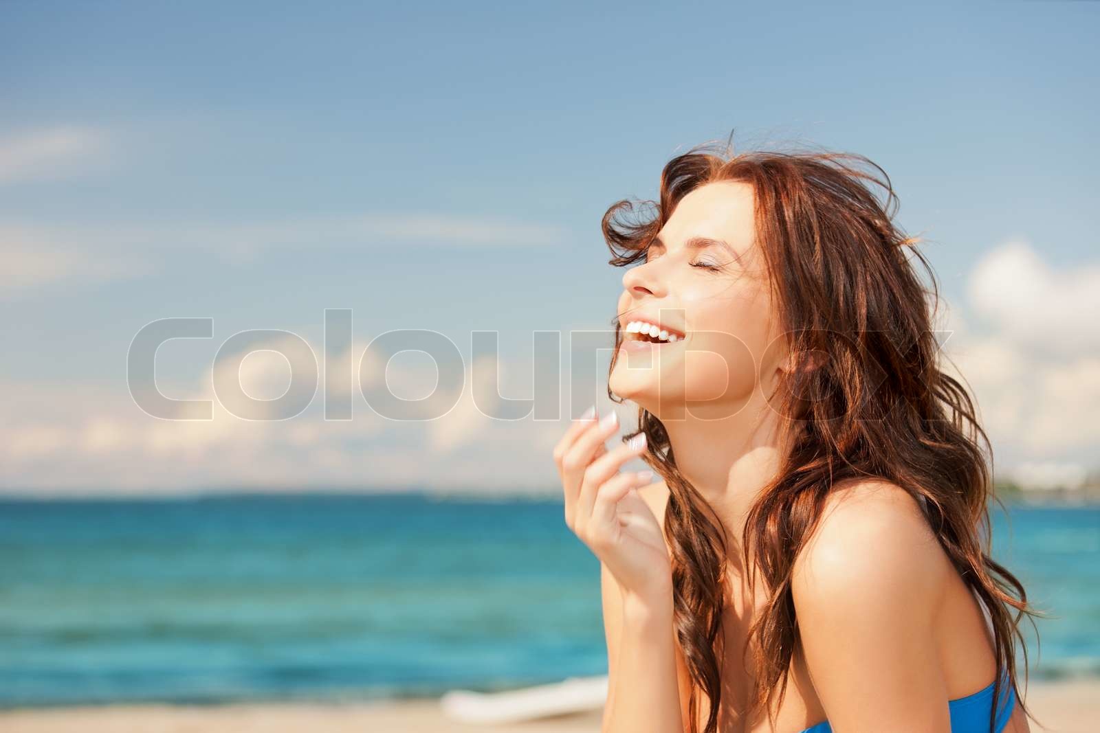 laughing woman on the beach | Stock image | Colourbox