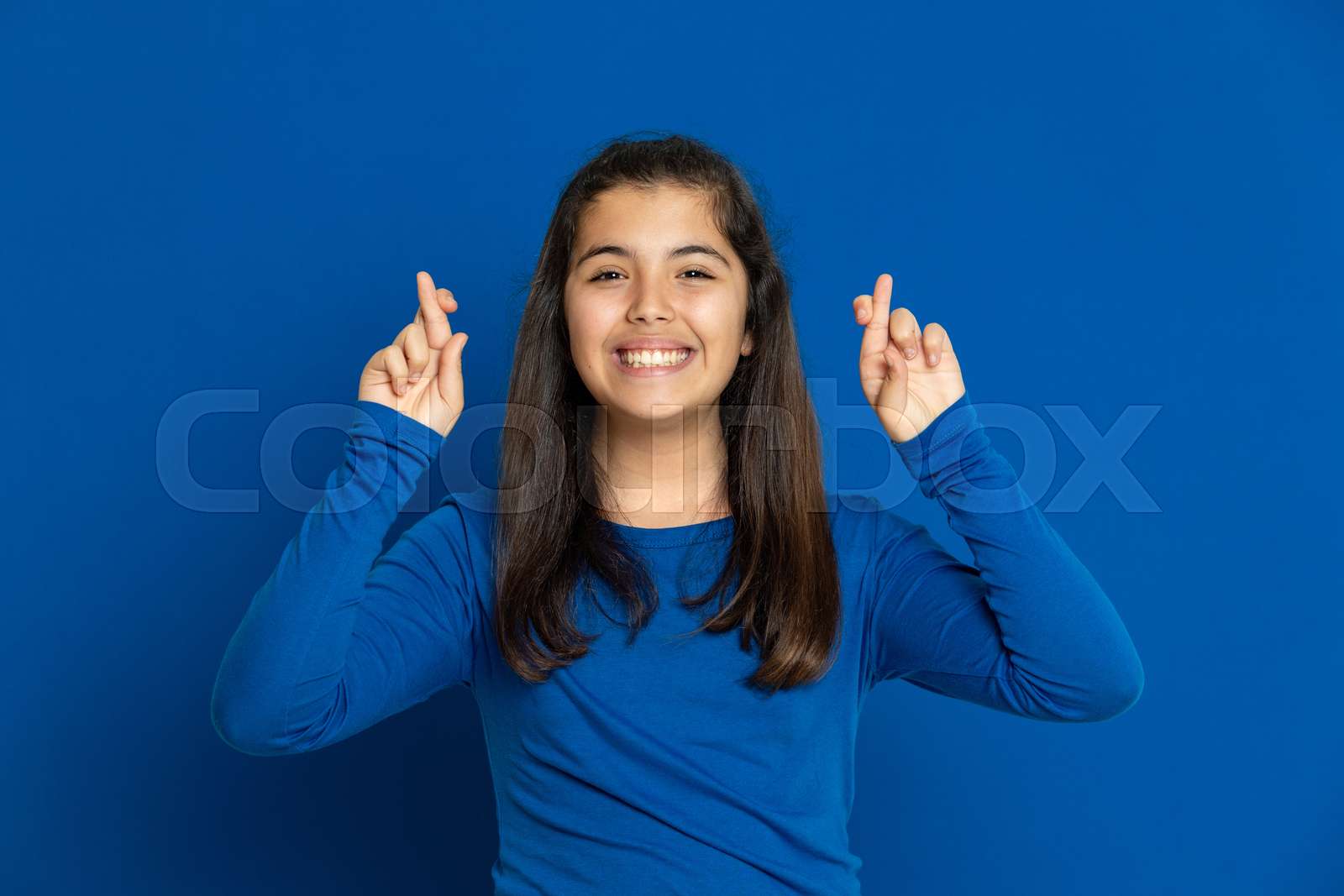 Adorable preteen girl with yellow jersey | Stock image | Colourbox