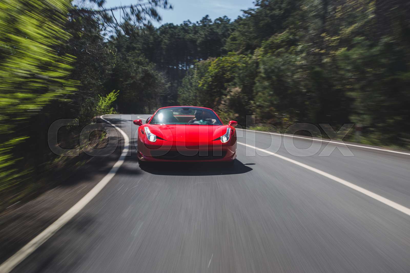 Red rally car on the forest road | Stock image | Colourbox