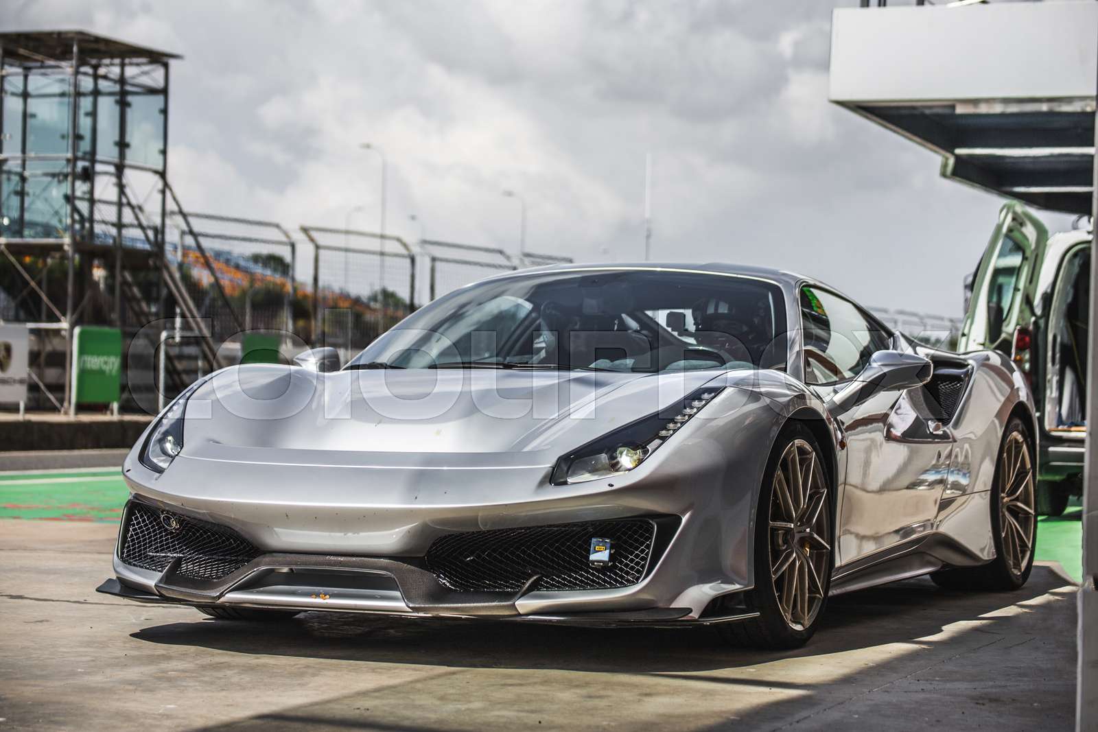 Silver racing car getting ready for a autoshow in the performance ...