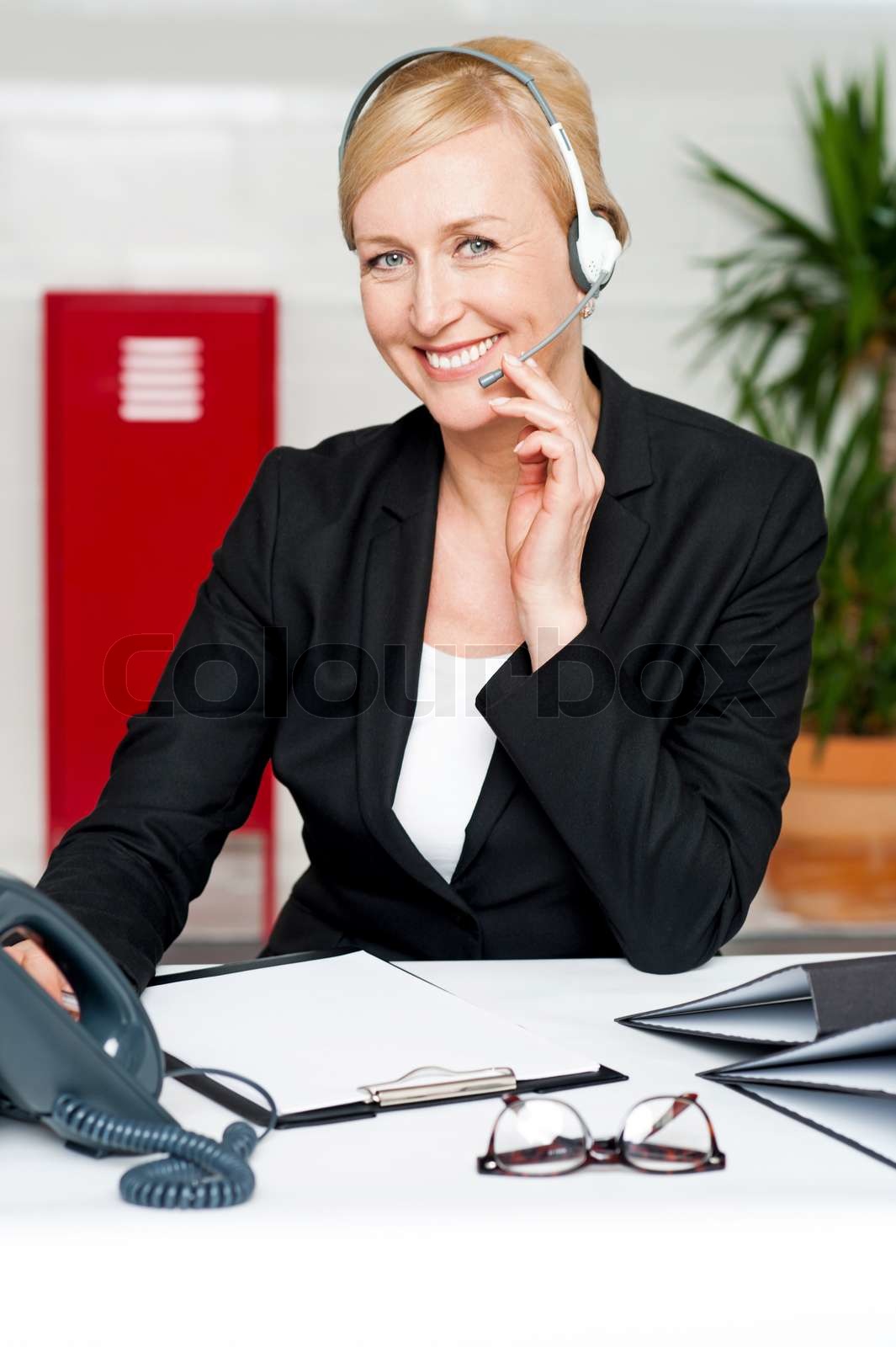 Customer support staff holding mic and communicating | Stock image ...