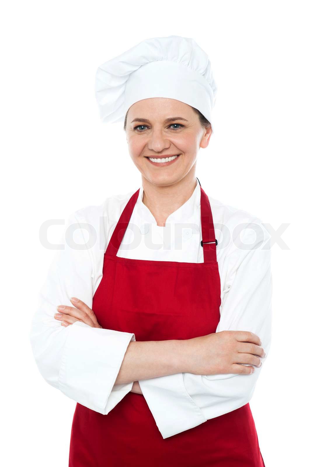 Portrait of smiling middle aged cook in uniform | Stock image | Colourbox