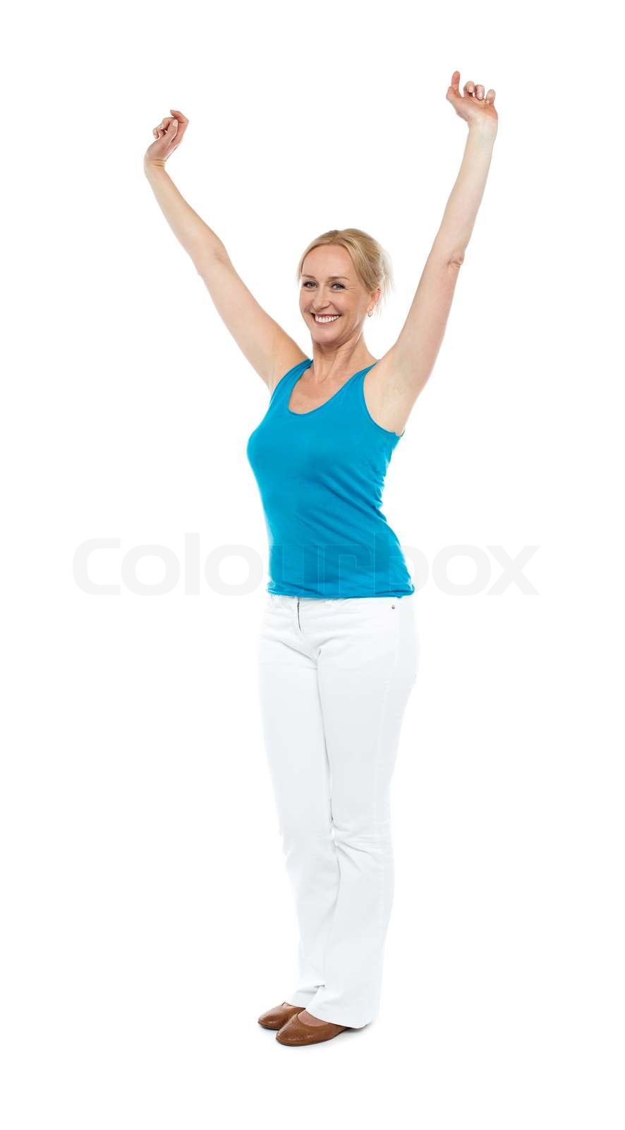 Successful woman posing with raised arms | Stock image | Colourbox