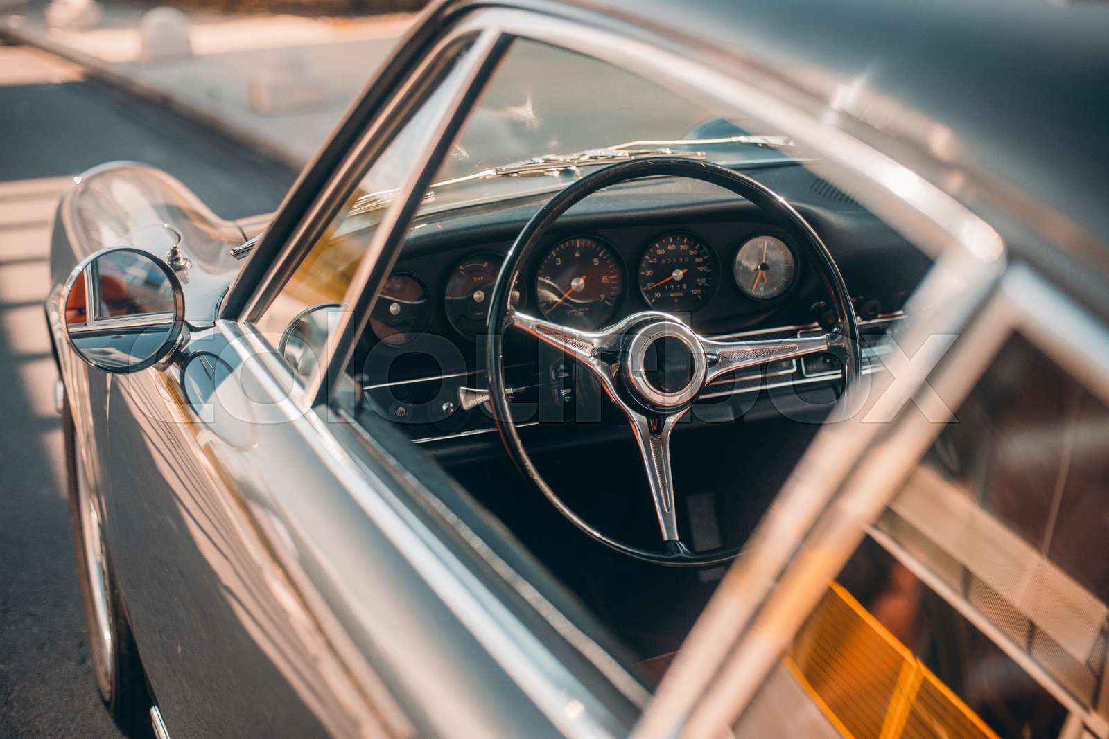 Control wheel and windows of a retro car, view through window | Stock ...