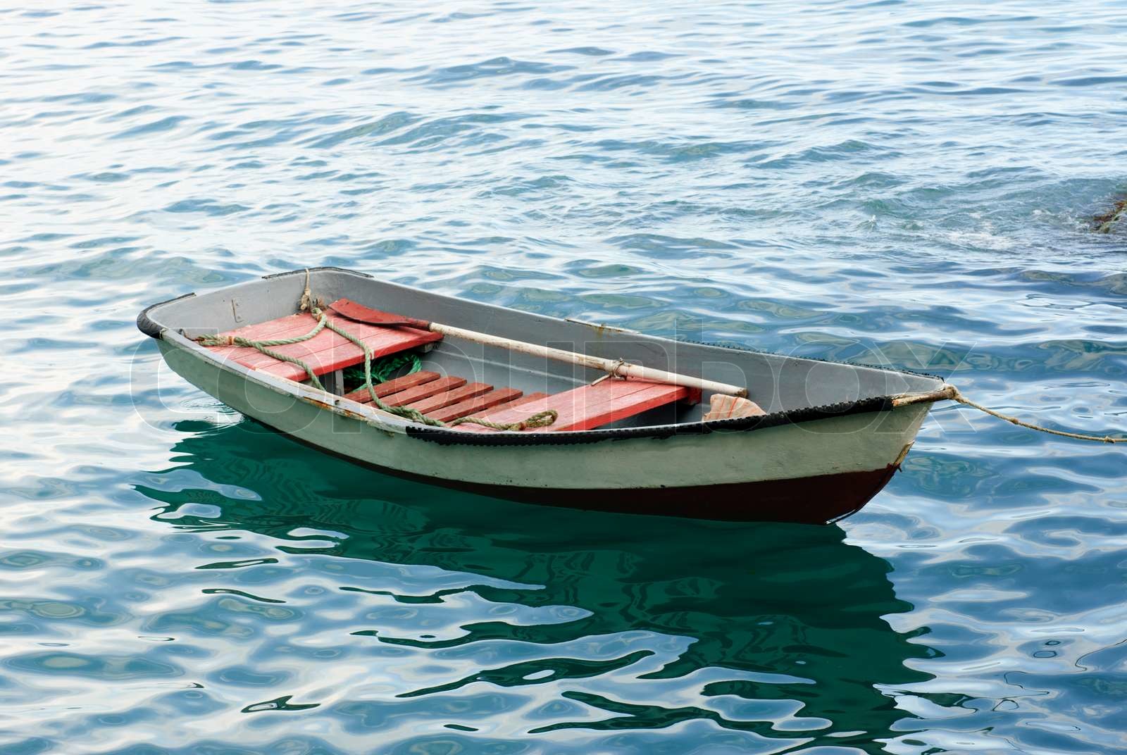 Lifeboat with paddle Old wooden boat | Stock image | Colourbox