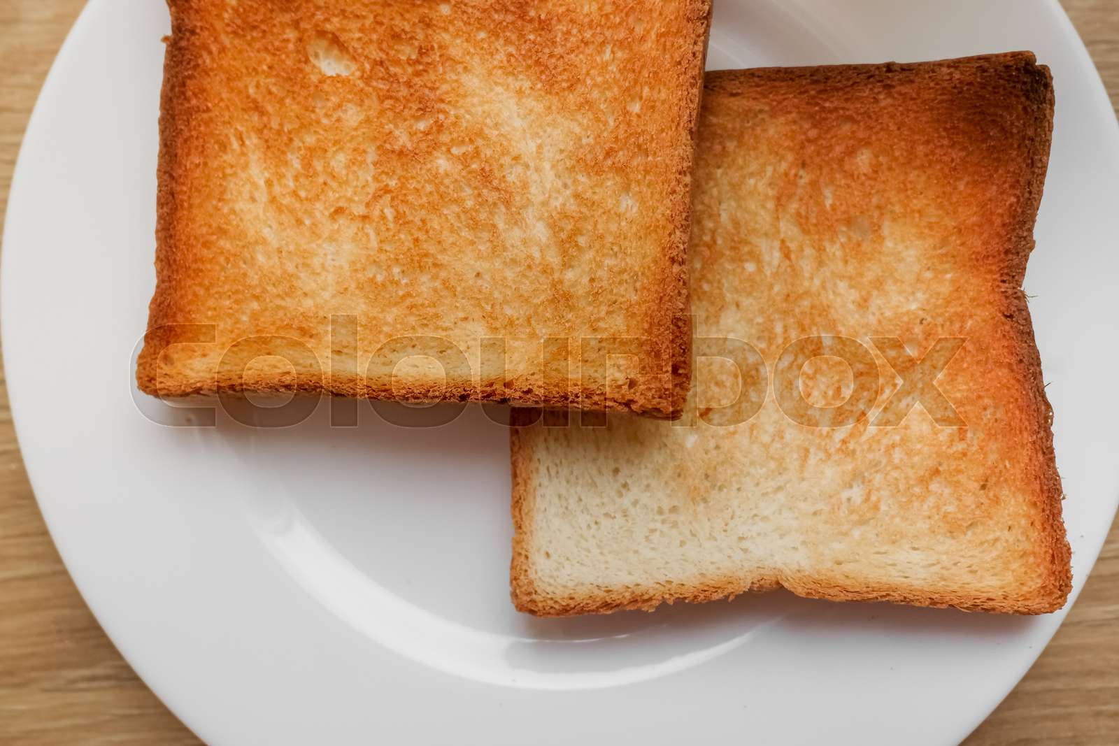 freshly baked toaster bread. Tasty toasted bread on wooden board. A ...