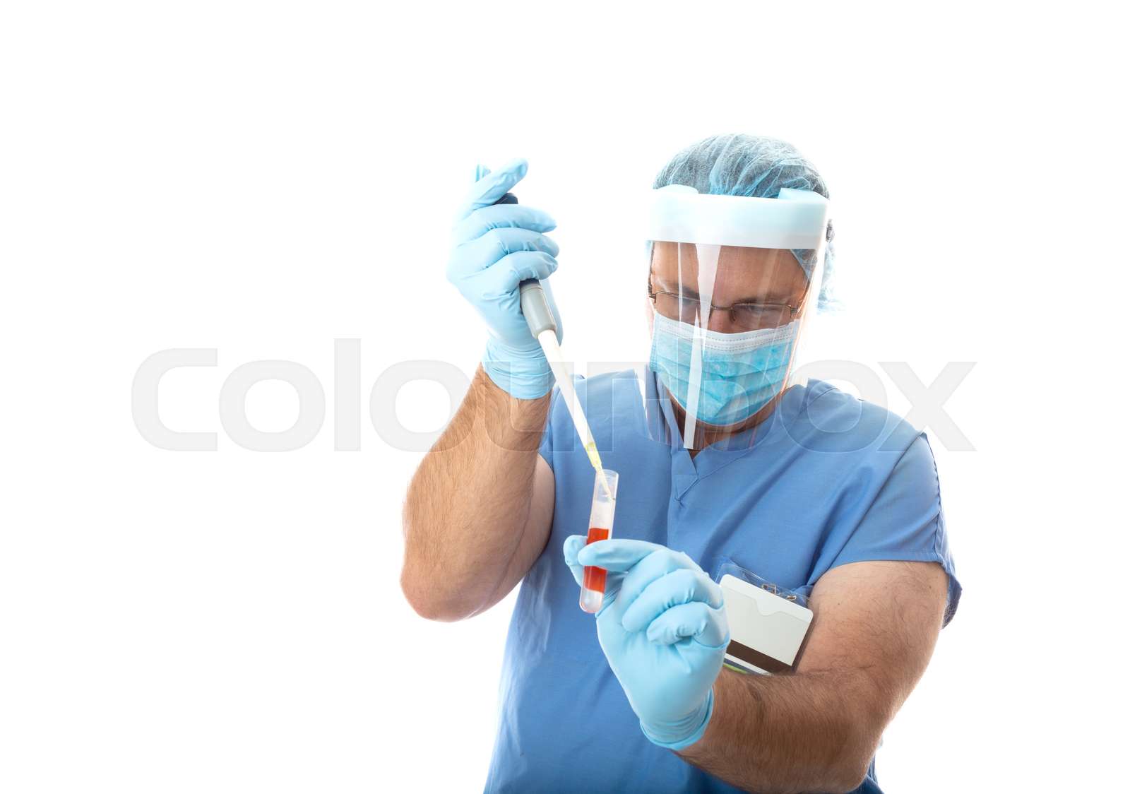 Pathology nurse aliquoting blood from a tube for diagnosis or research ...