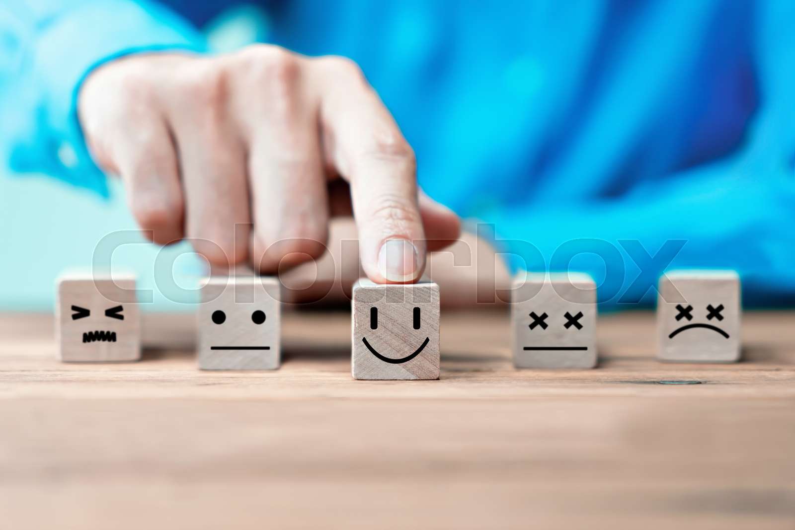 Businessman chooses a happy emoticon icons face. Service, communication ...