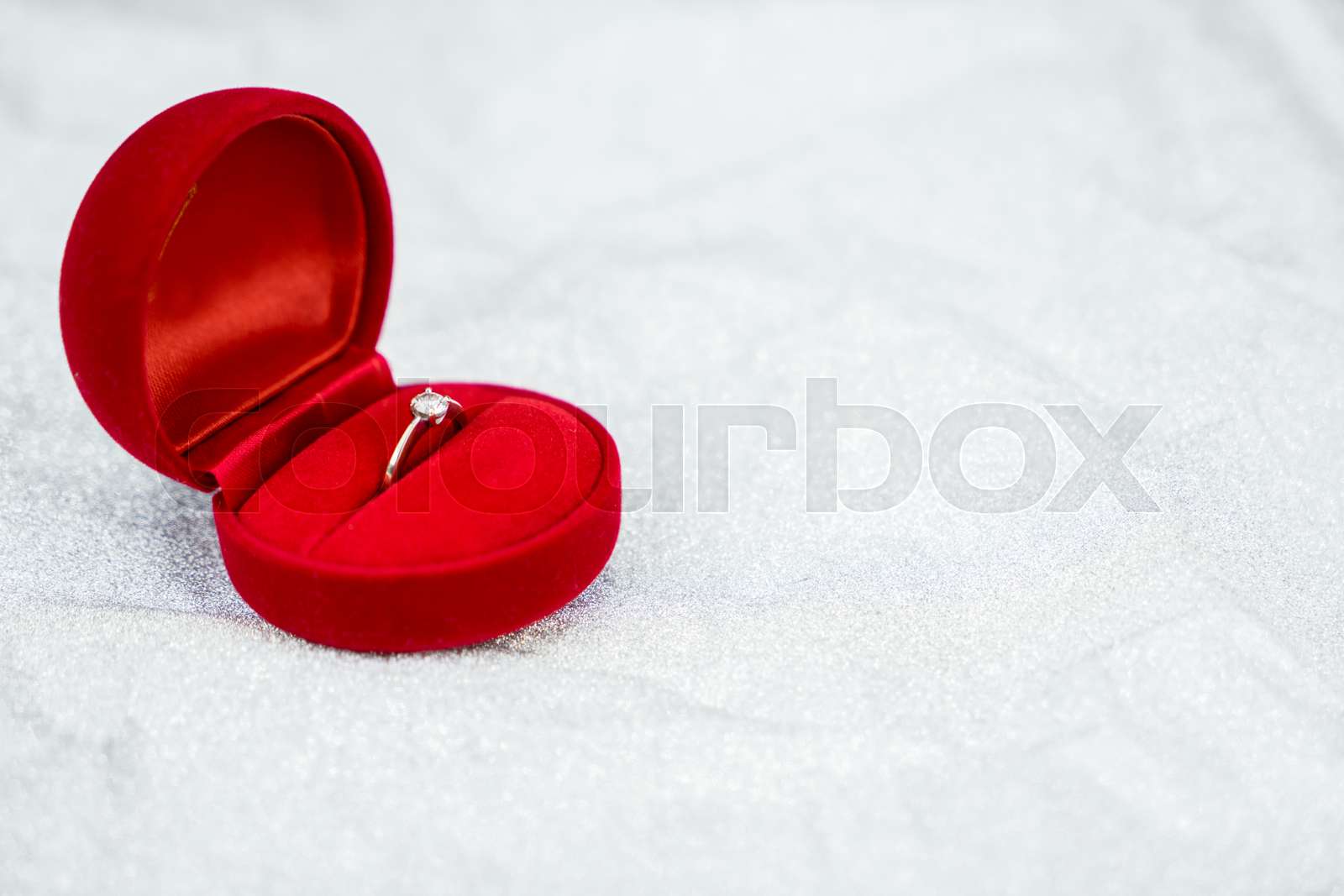 Red ring box with diamond ring for wedding day | Stock image | Colourbox