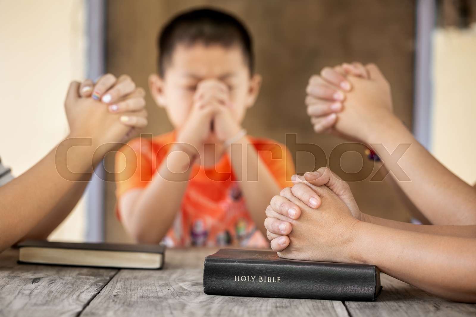 Christian family worship God in home | Stock image | Colourbox