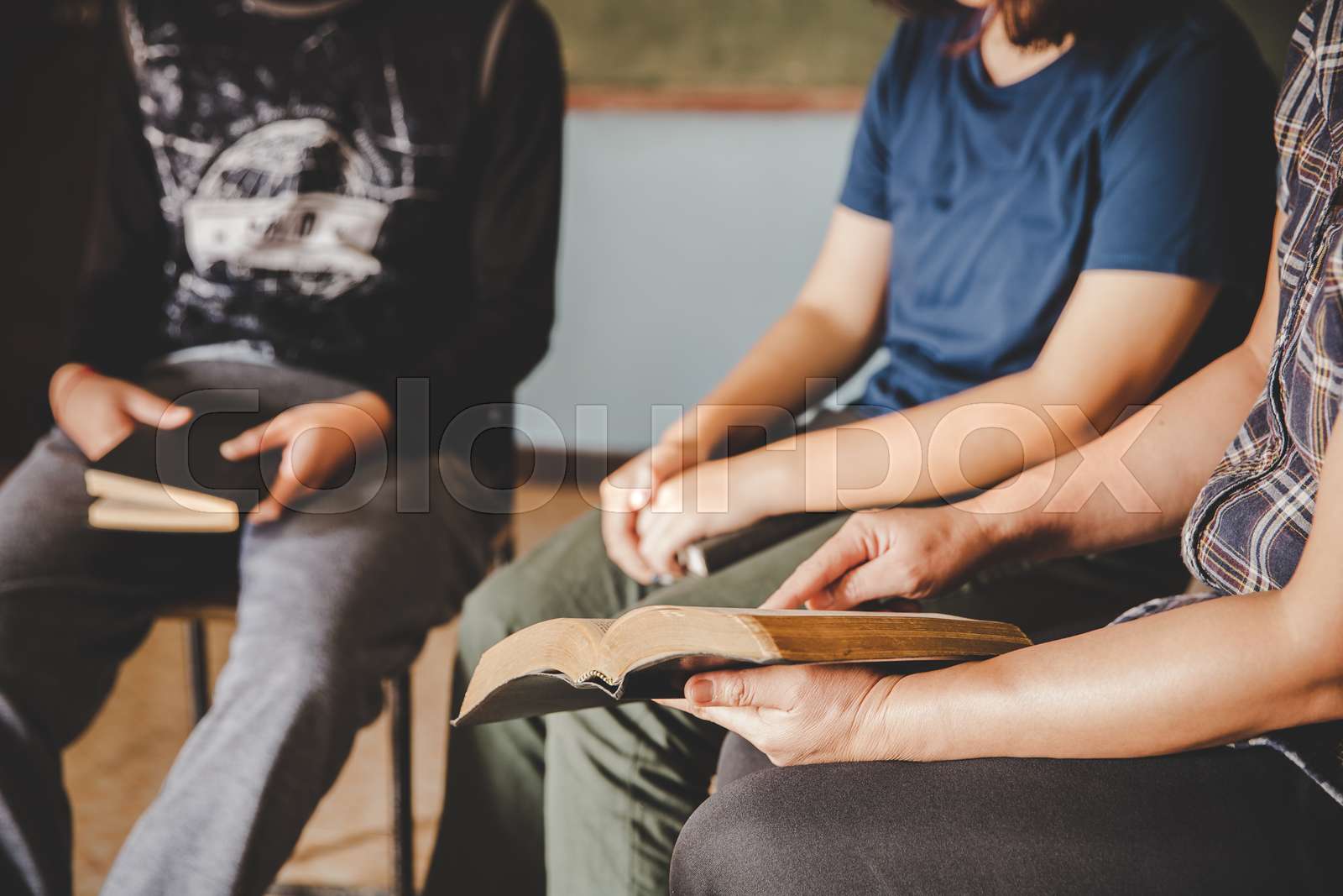 Christian family worship God in home | Stock image | Colourbox
