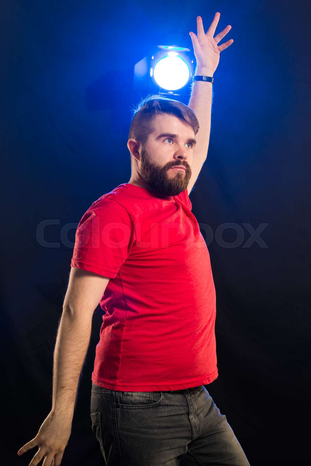 Young crazy man dancing. Joke and humor concept. | Stock image | Colourbox