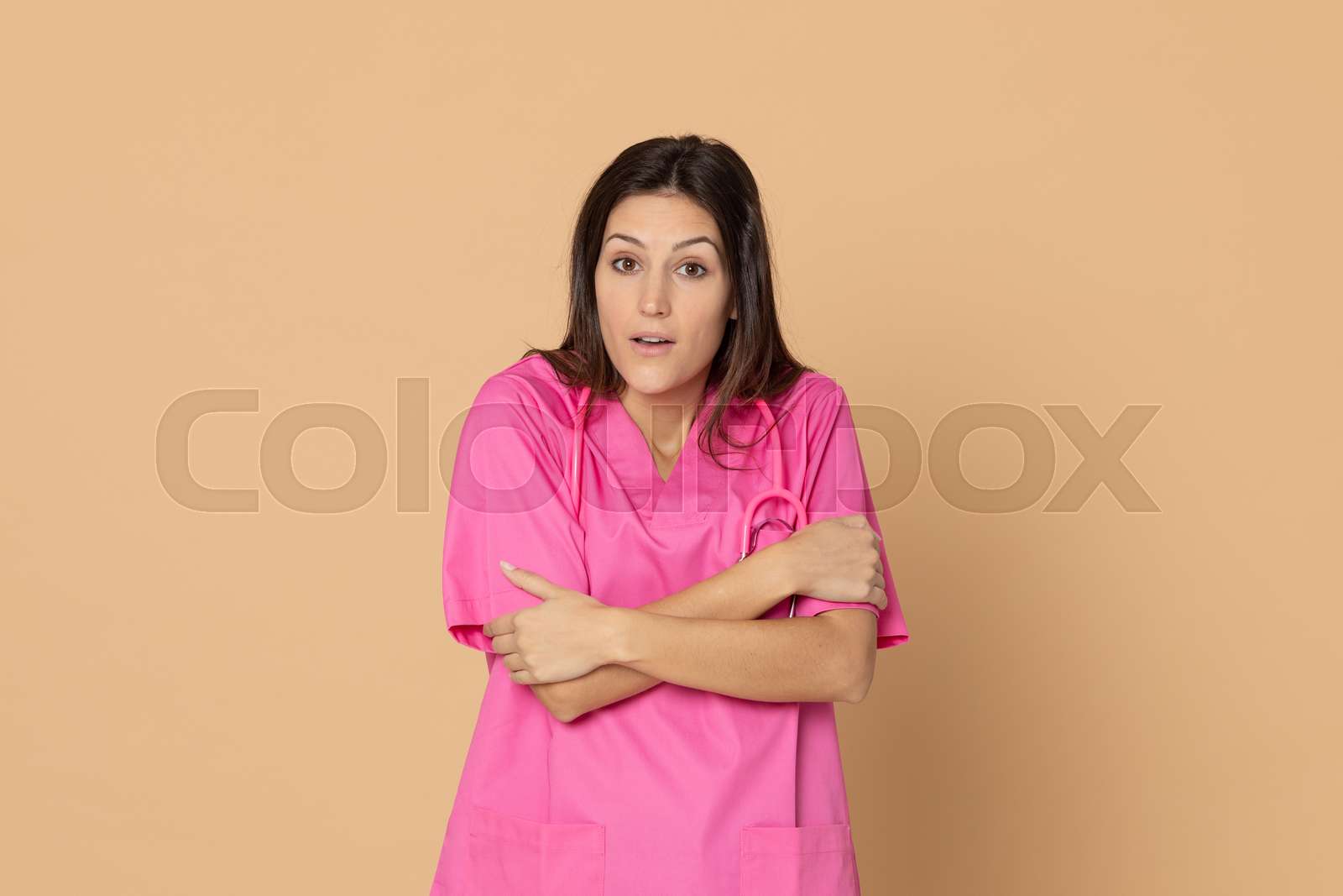 Young doctor with a pink uniform | Stock image | Colourbox