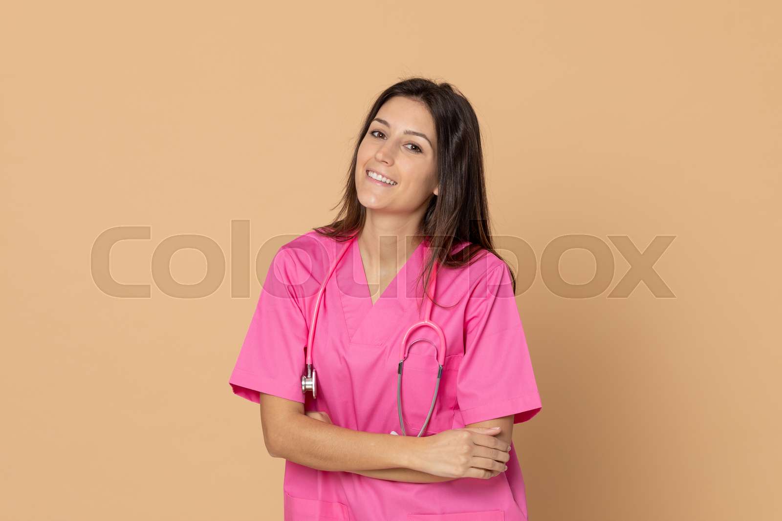 Young doctor with a pink uniform | Stock image | Colourbox