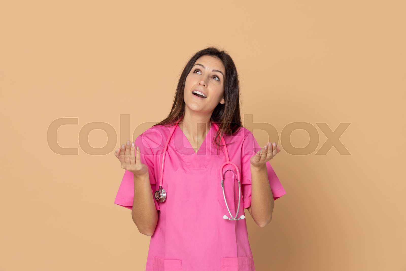 Young doctor with a pink uniform | Stock image | Colourbox