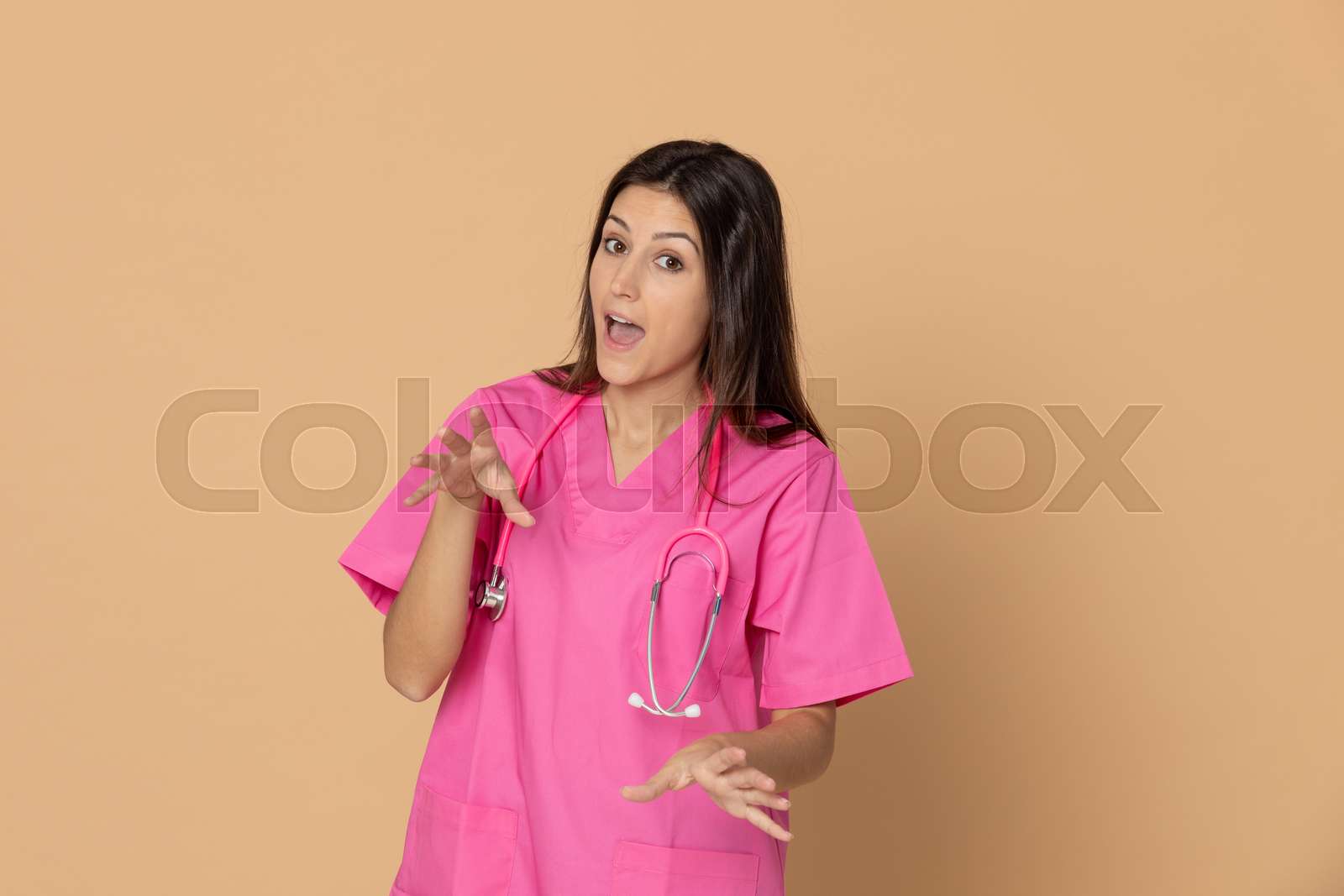 Young doctor with a pink uniform | Stock image | Colourbox