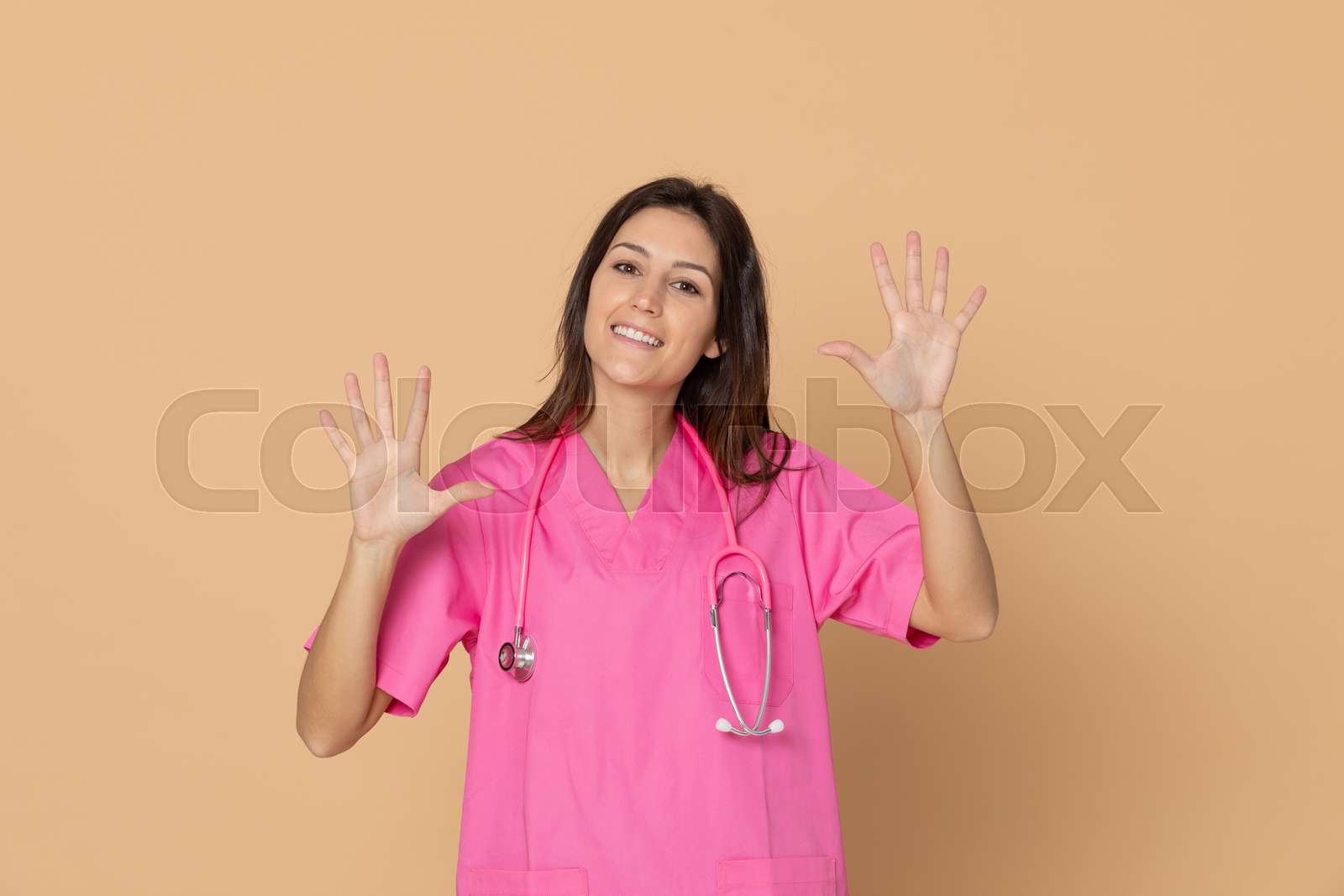 Young doctor with a pink uniform | Stock image | Colourbox