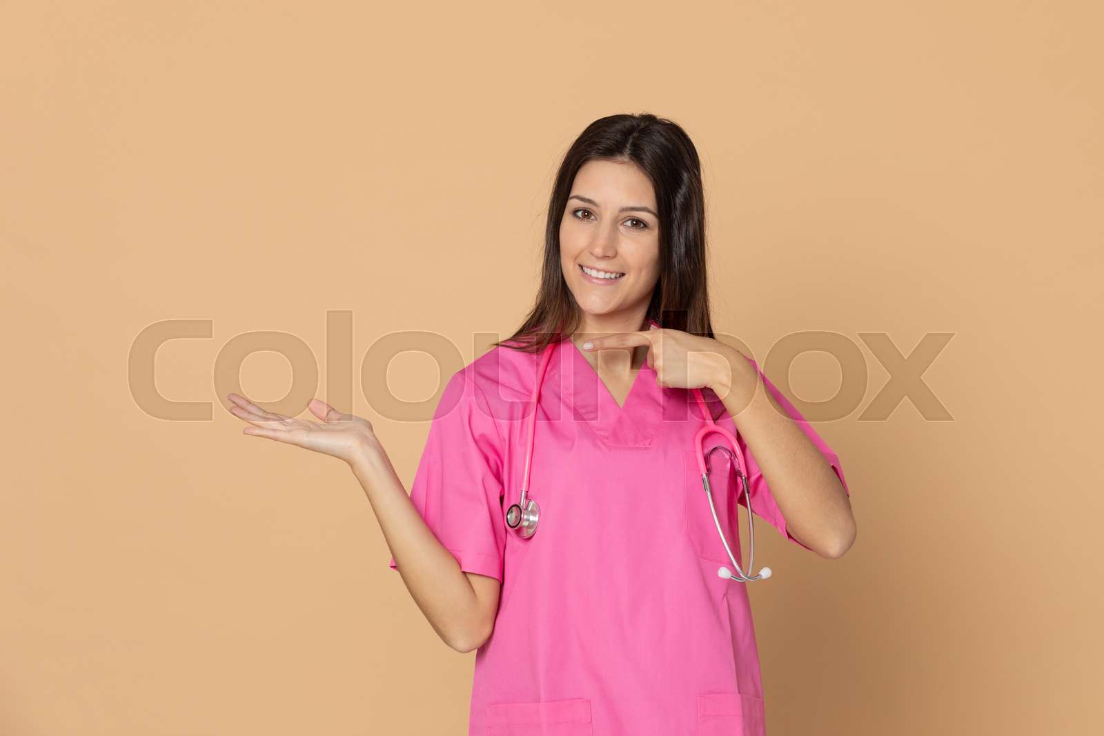 Young doctor with a pink uniform | Stock image | Colourbox