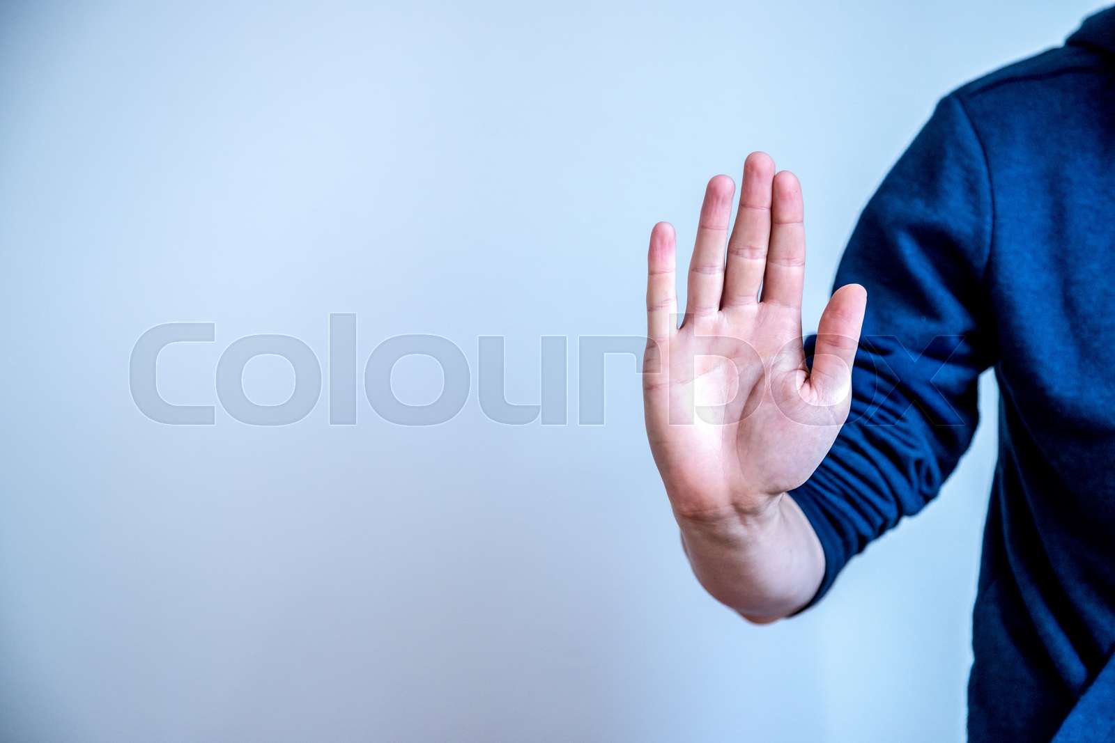 Defense or stop gesture: Male hand with stop gesture | Stock image ...