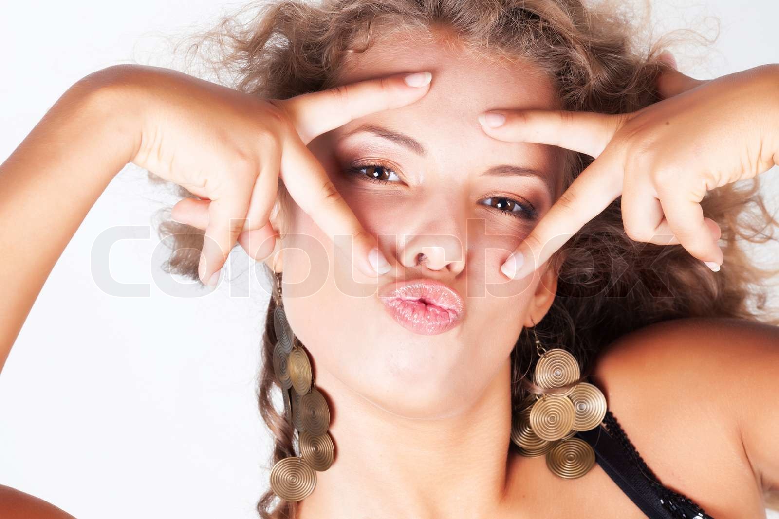 Girl with hands near face | Stock image | Colourbox