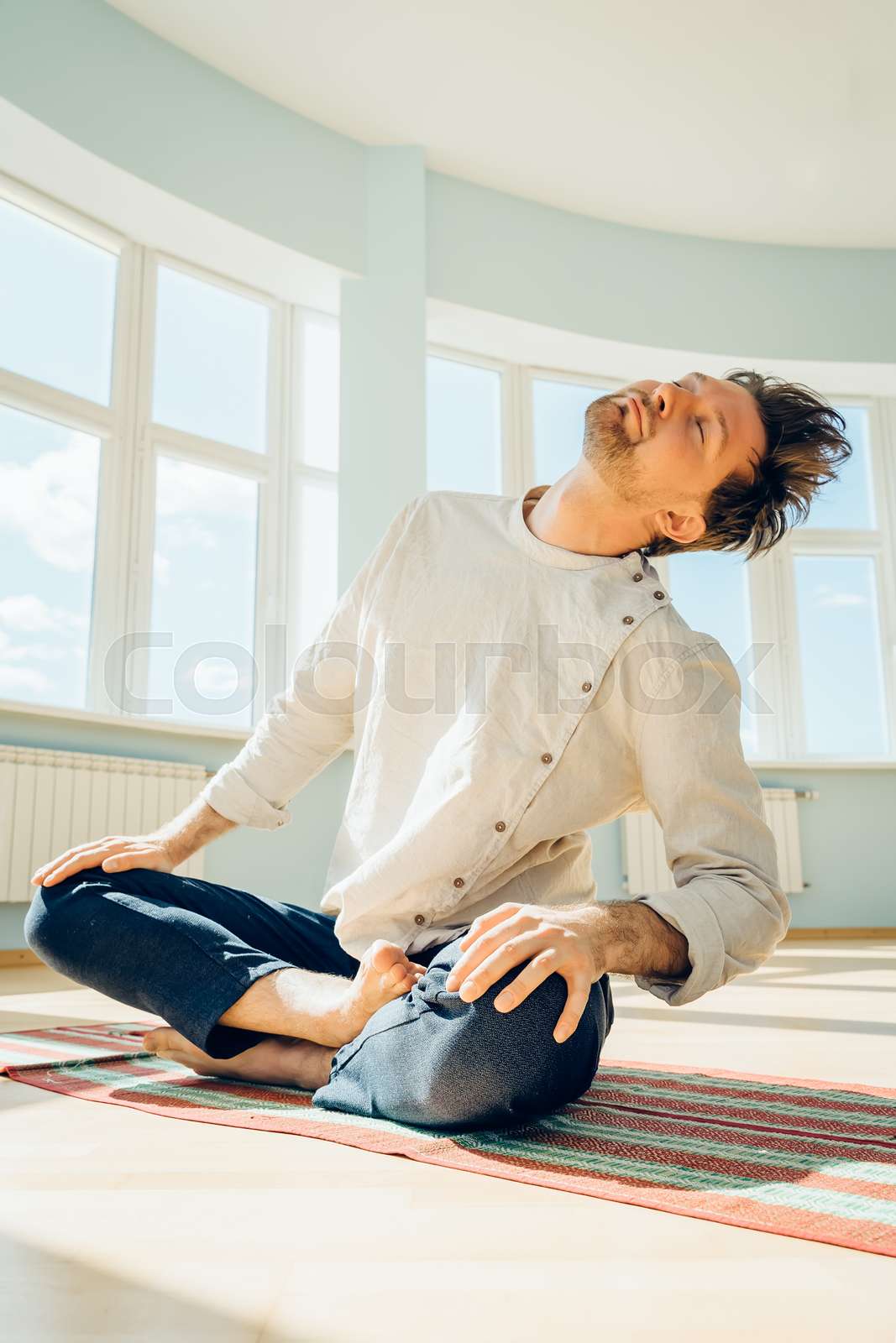 Man practice yoga. Young attractive male doing breathing exercises. Guy ...
