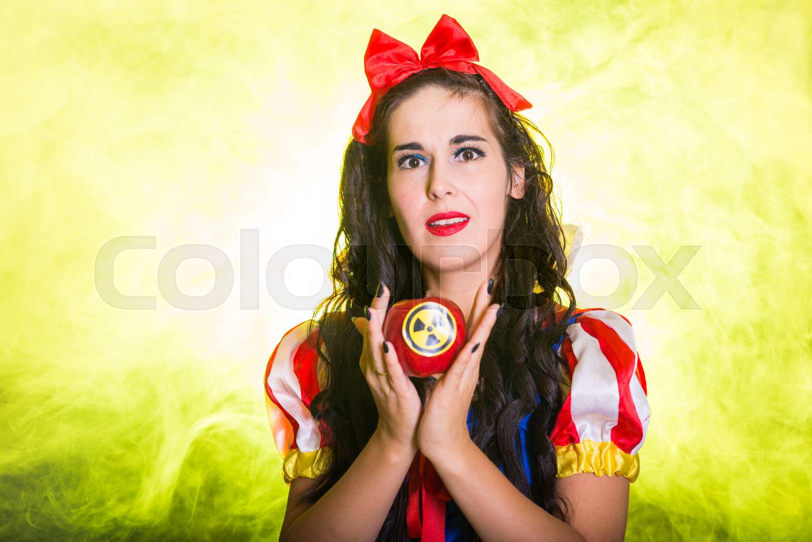 Woman holding hazardous radioactive apple. Nuclear and radiation ...