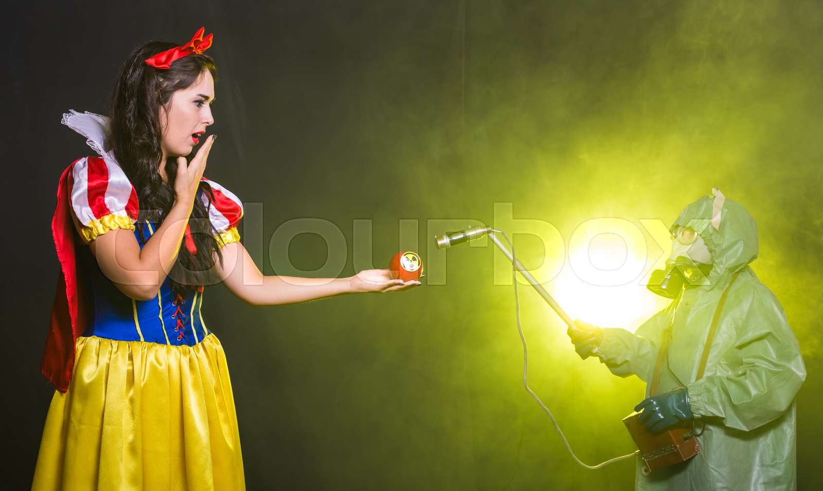 Woman dressed as fairytale character holds Radioactive atomic nuclear ...