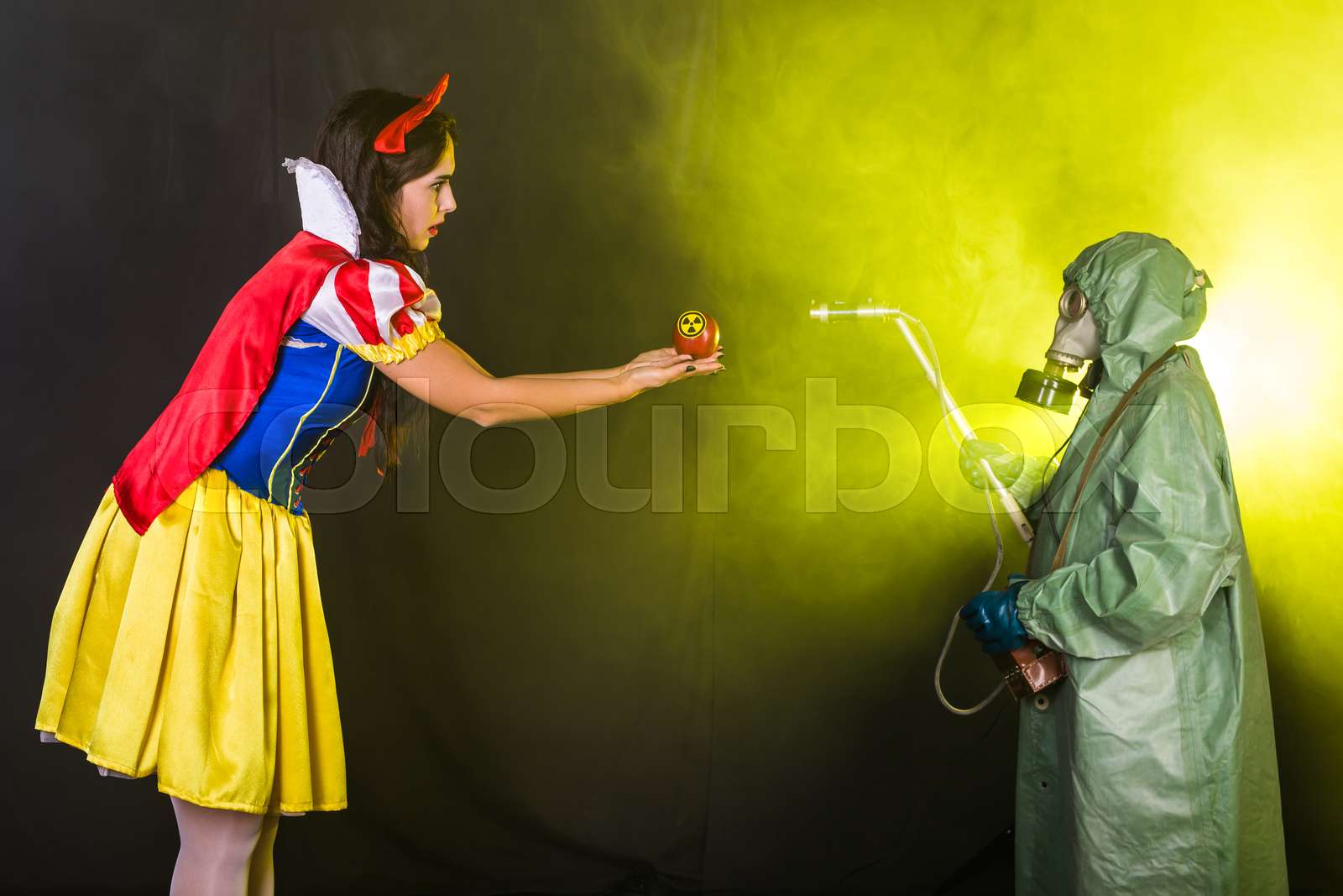 Woman holding hazardous radioactive apple. Nuclear and radiation ...