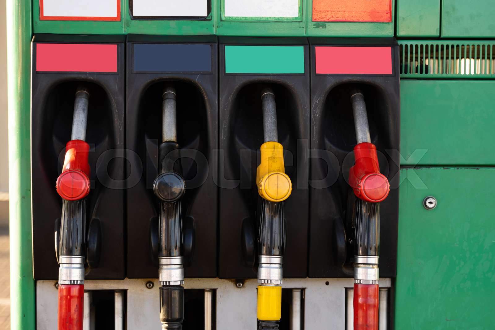 Four fuel pumps at a gas station. | Stock image | Colourbox