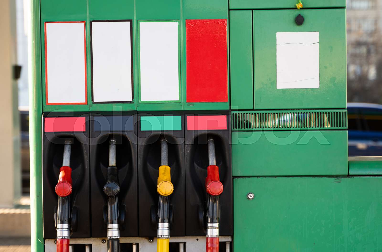 Four fuel pumps at a gas station. | Stock image | Colourbox