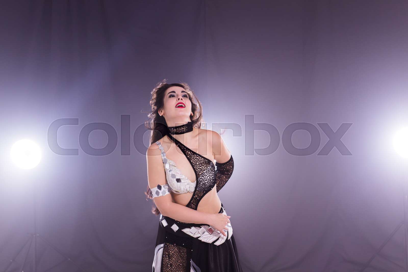 Young Woman Belly Dancer In Exotic Dress With Gold Dancing Tribal