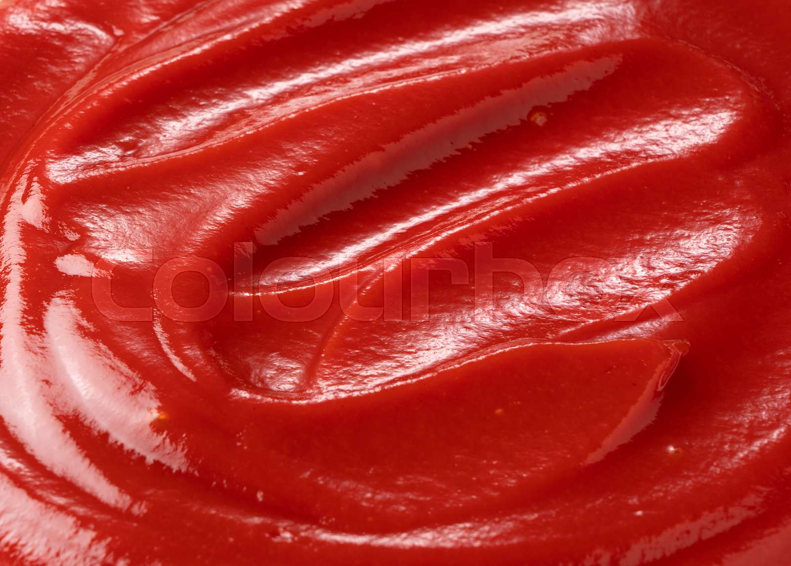 Wave of ketchup on the entire screen | Stock image | Colourbox