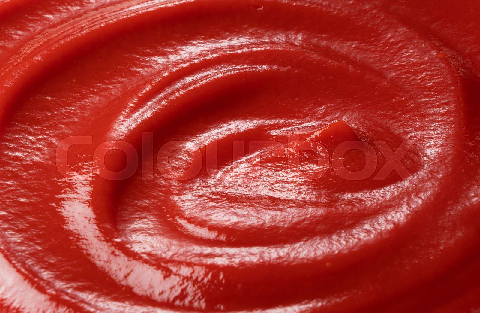 Wave of ketchup on the entire screen | Stock image | Colourbox