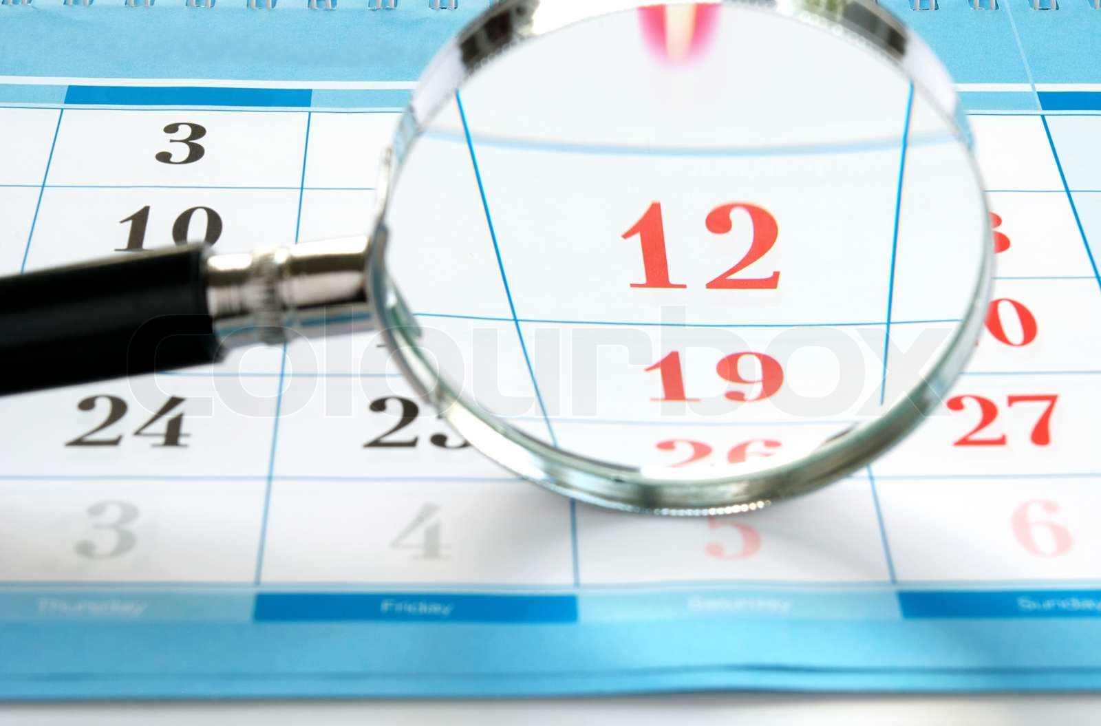 magnifying glass and a calendar | Stock image | Colourbox