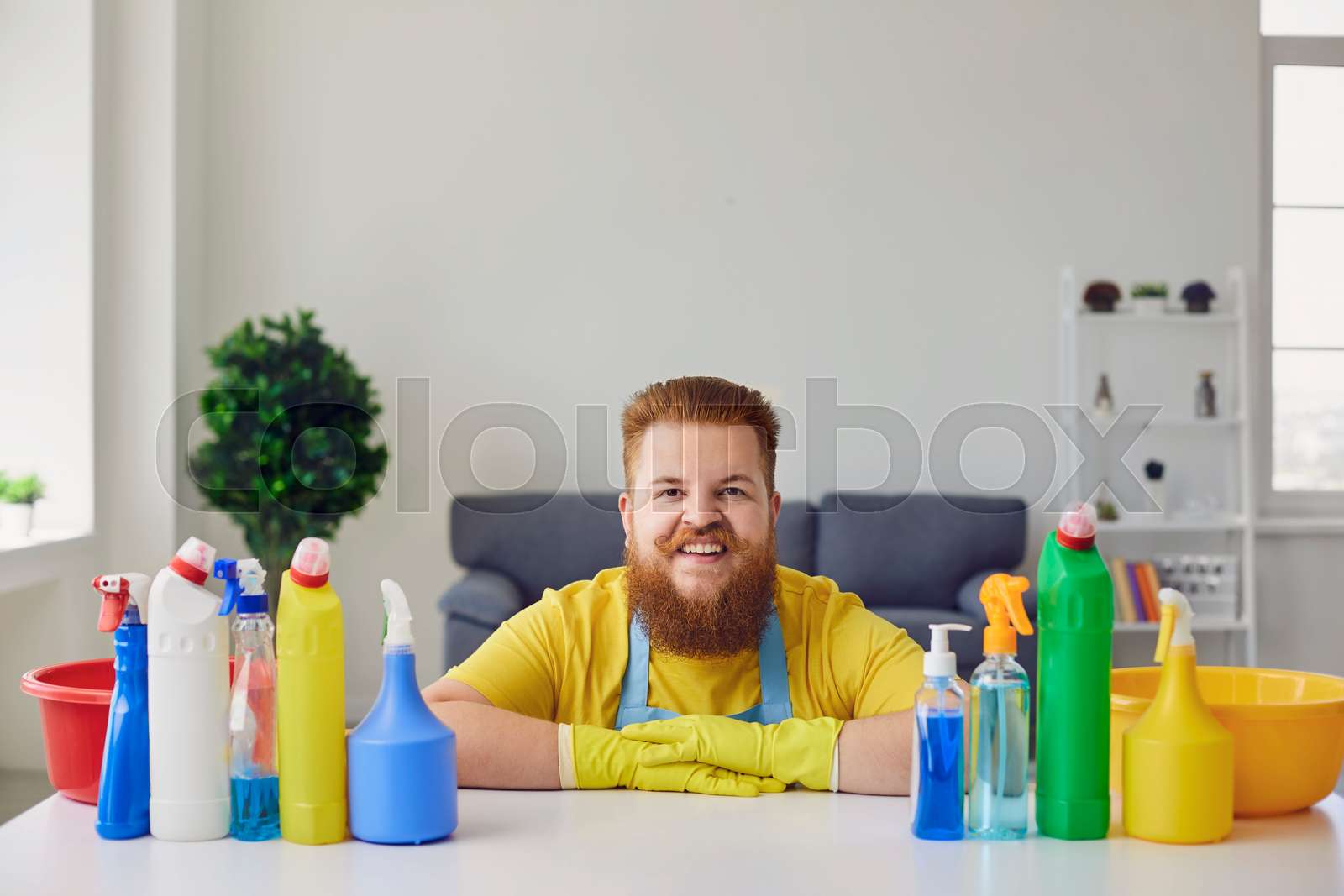 Happy funny fat man in apron cleans the room in the house. | Stock ...