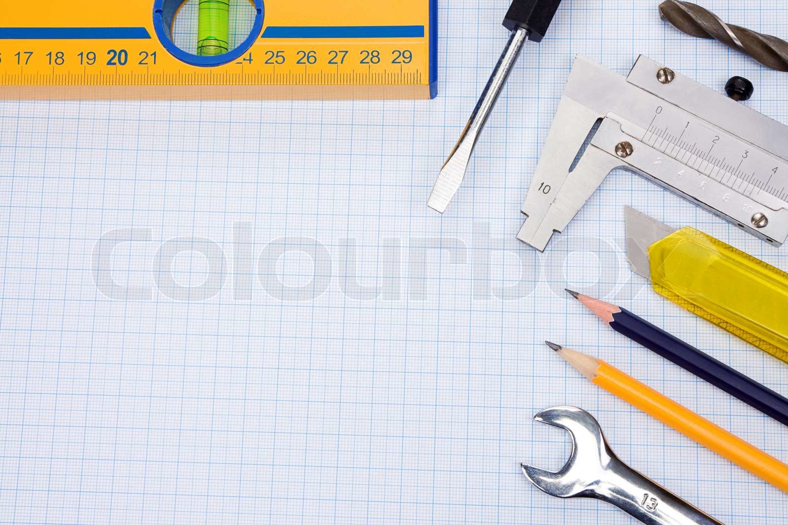 tools and instrument on graph grid paper | Stock image | Colourbox