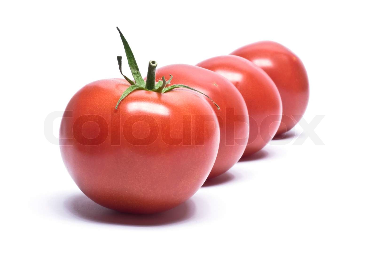 Four tomatoes | Stock image | Colourbox